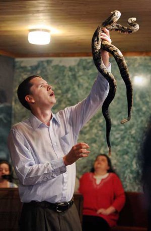 Young snake handlers grasp the dangerous power of faith