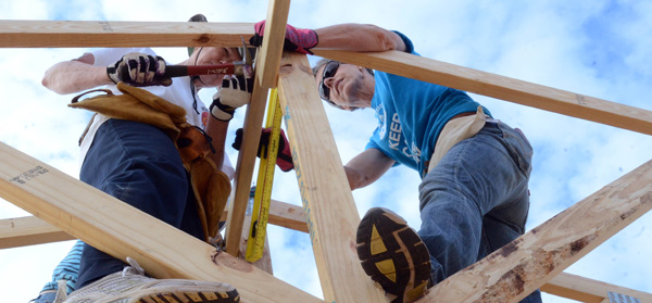 Volunteers build community one house at a time